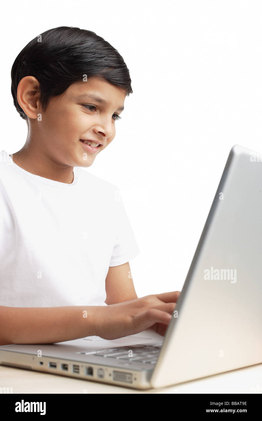 Boy using laptop Stock Photo - Alamy
