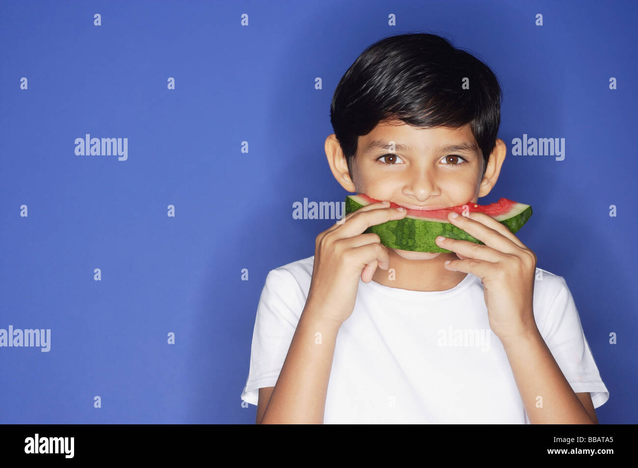 Smiling boy eating slice watermelon hi-res stock photography and images ...