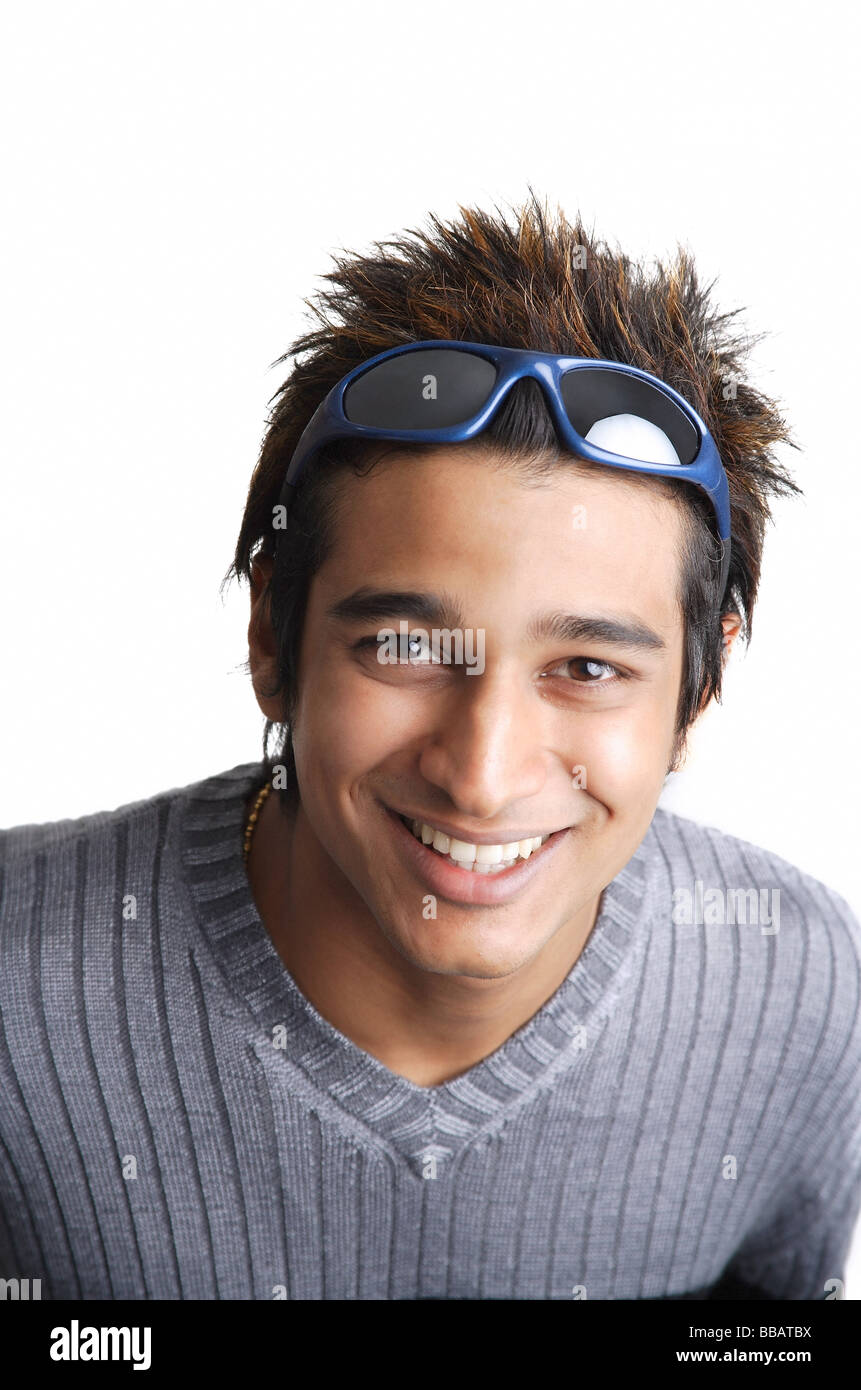 Man with sunglasses on head, smiling at camera Stock Photo - Alamy