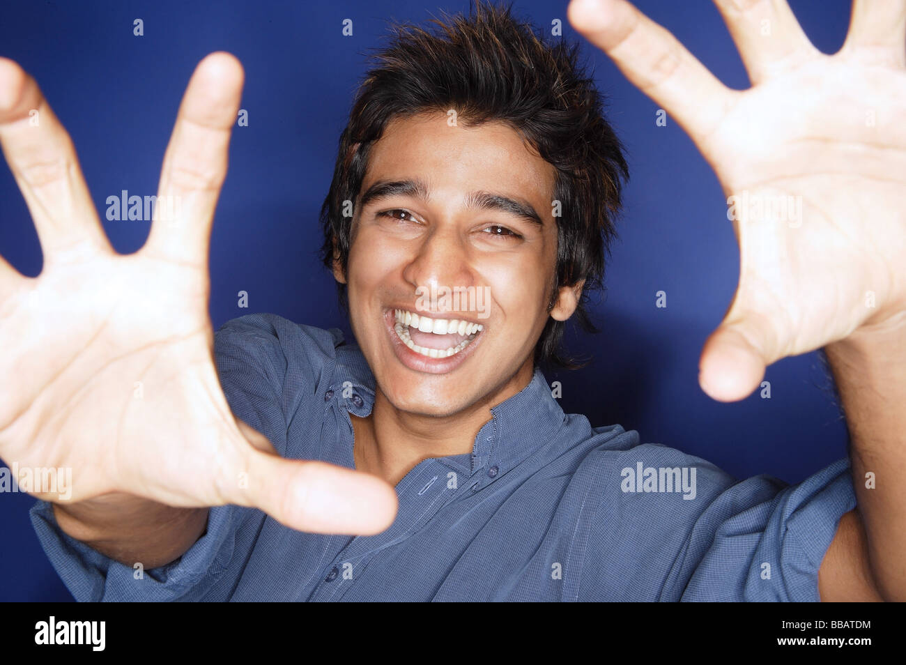 Man showing open palms smiling hi-res stock photography and images - Alamy