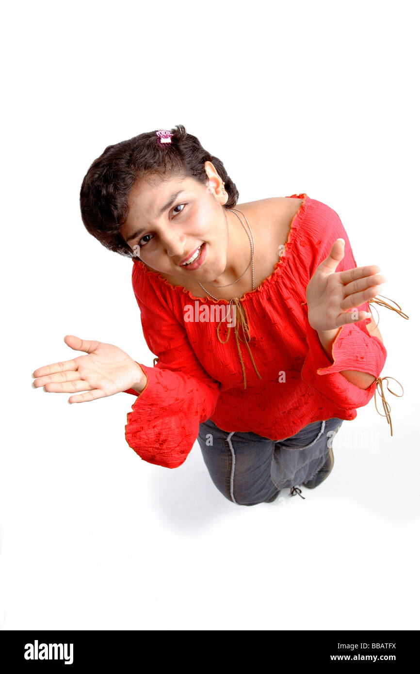 Woman looking up, hands open towards camera Stock Photo - Alamy