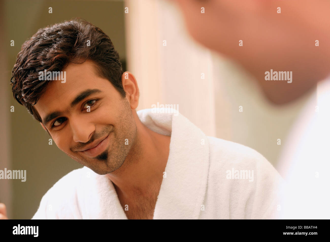 Asian man looking in bathroom mirror hi-res stock photography and ...