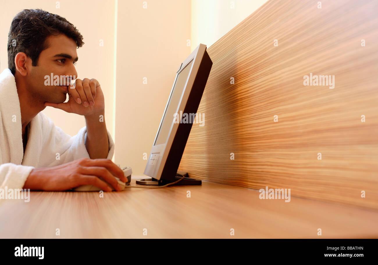 Man using computer at home Stock Photo - Alamy