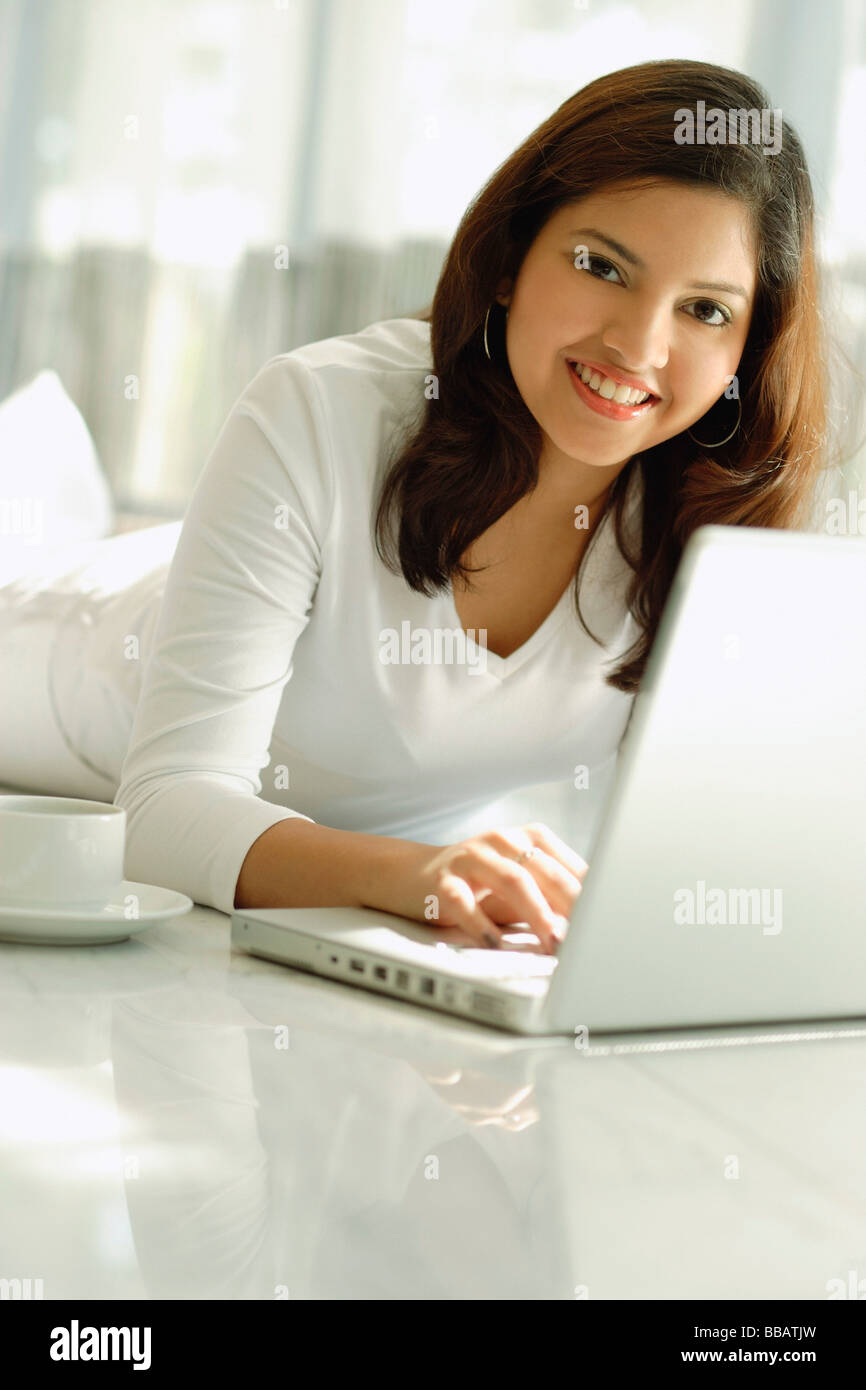 Woman at home with laptop Stock Photo - Alamy