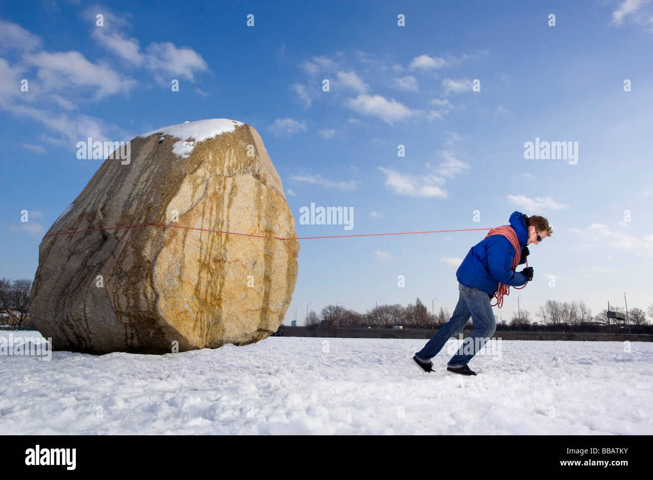 Man pulling boulder Stock Photo - Alamy