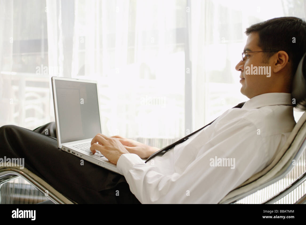 Businessman using laptop Stock Photo - Alamy
