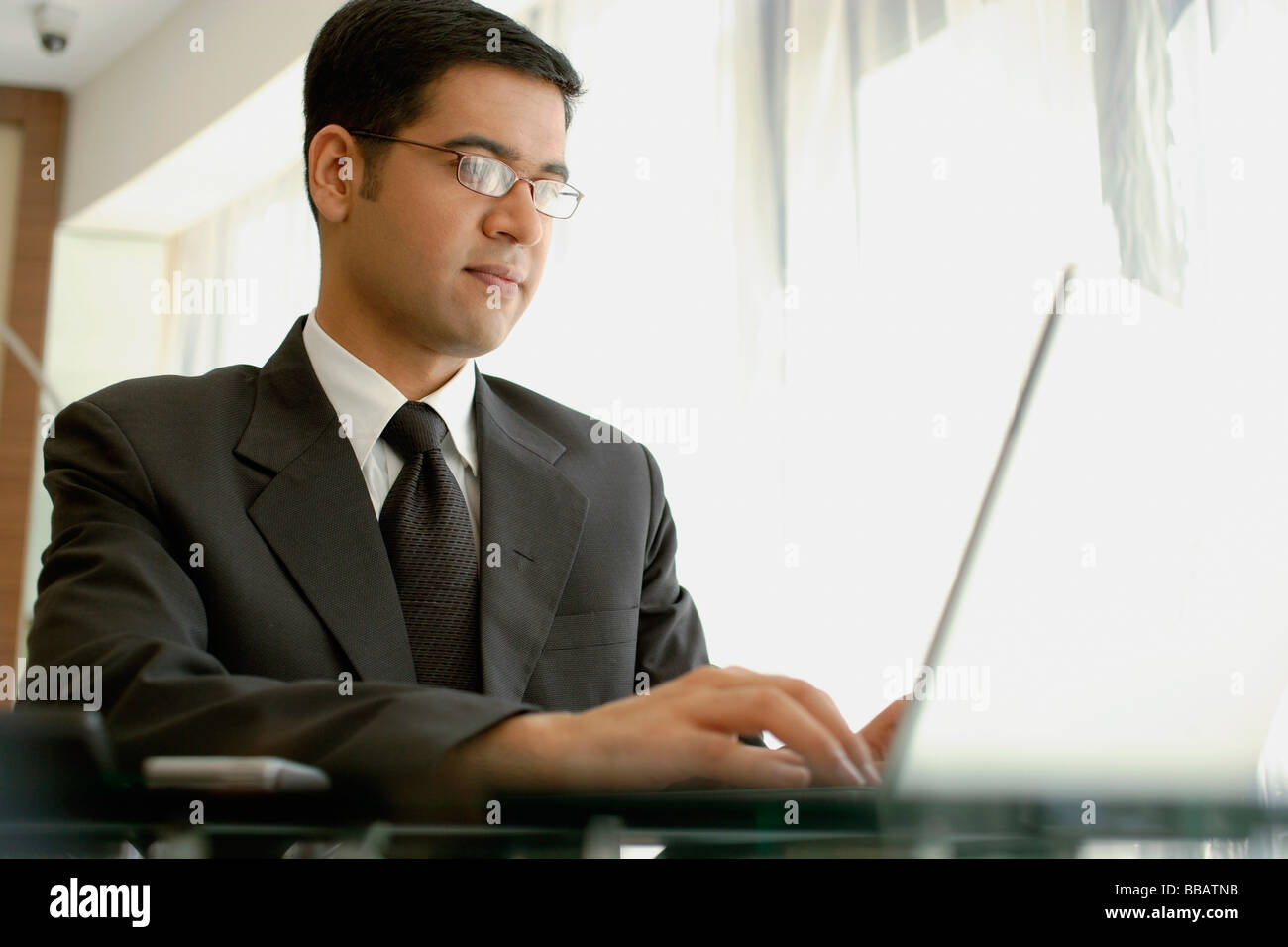 Businessman using laptop Stock Photo - Alamy