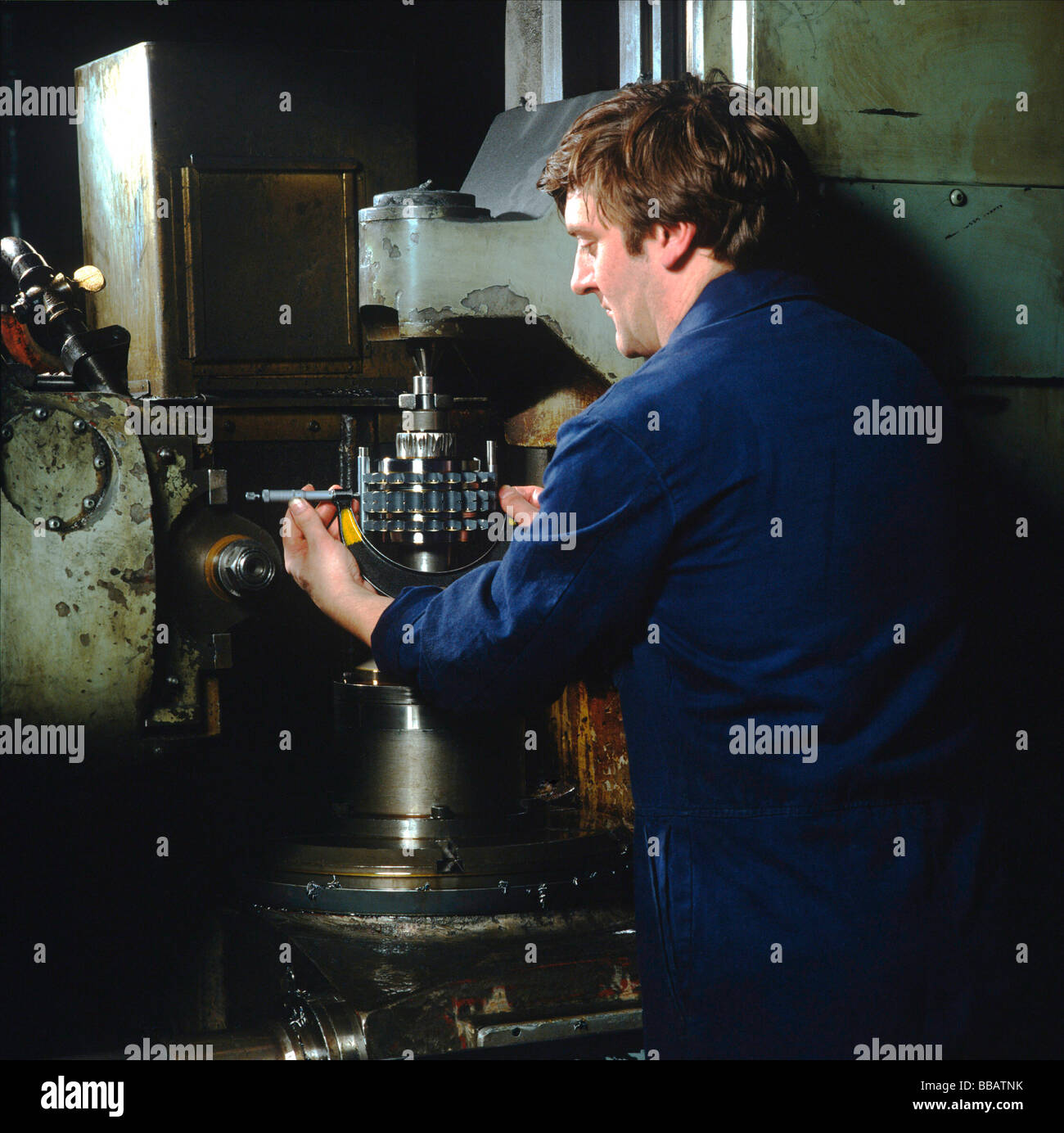 Machinist checks the measurements on a gear wheel Stock Photo - Alamy
