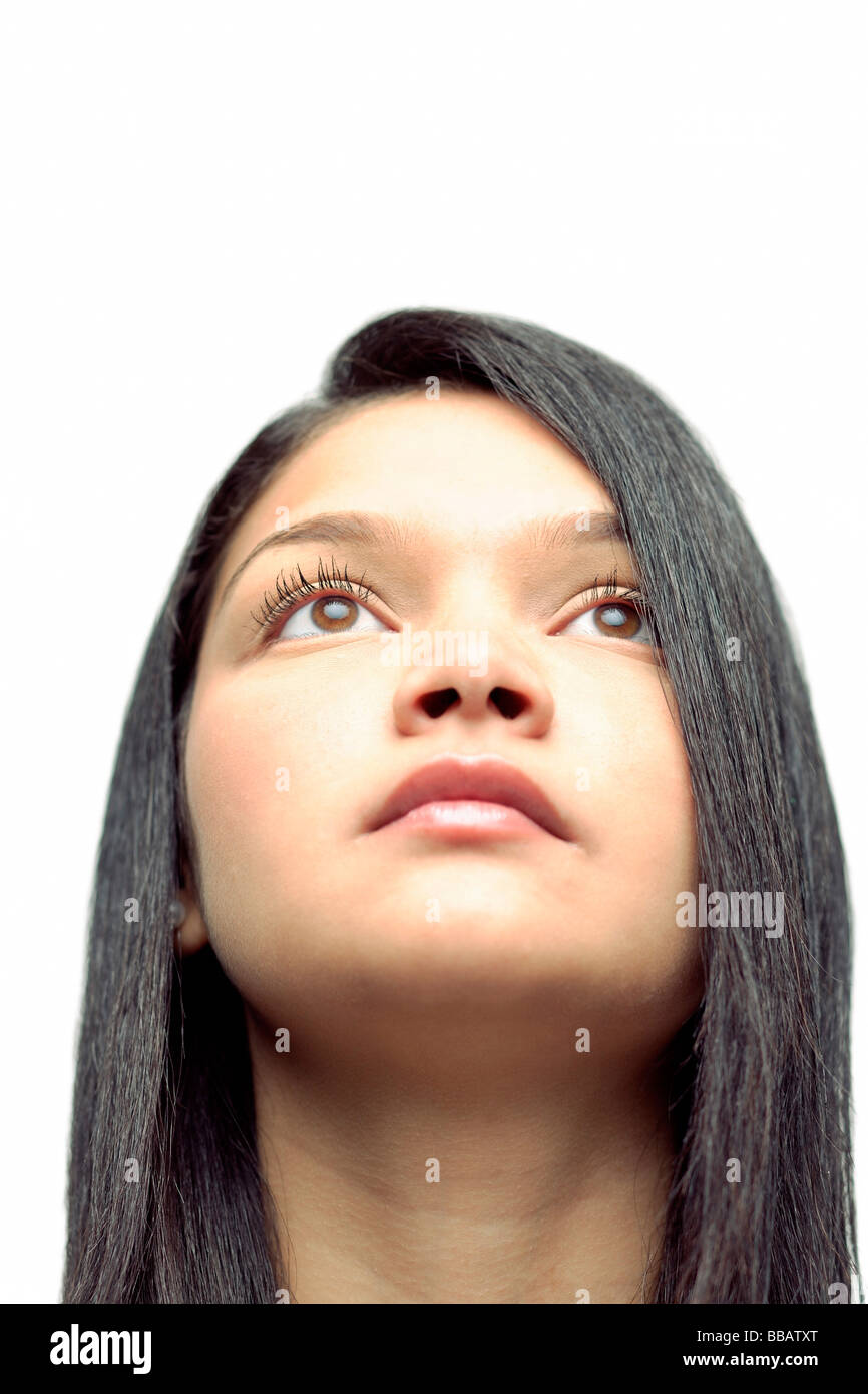 Woman looking up, head shot Stock Photo - Alamy