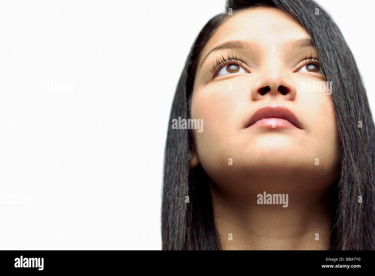 Woman looking up, head shot Stock Photo - Alamy