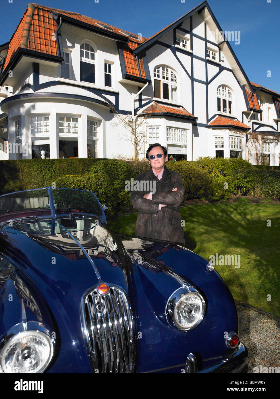Man in front of his house and car Stock Photo - Alamy