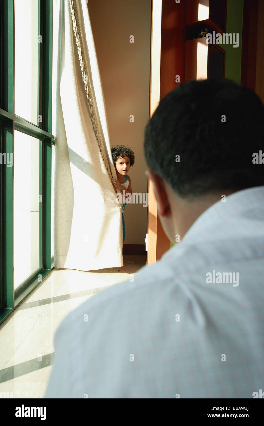 Child hiding behind curtain hi-res stock photography and images - Alamy