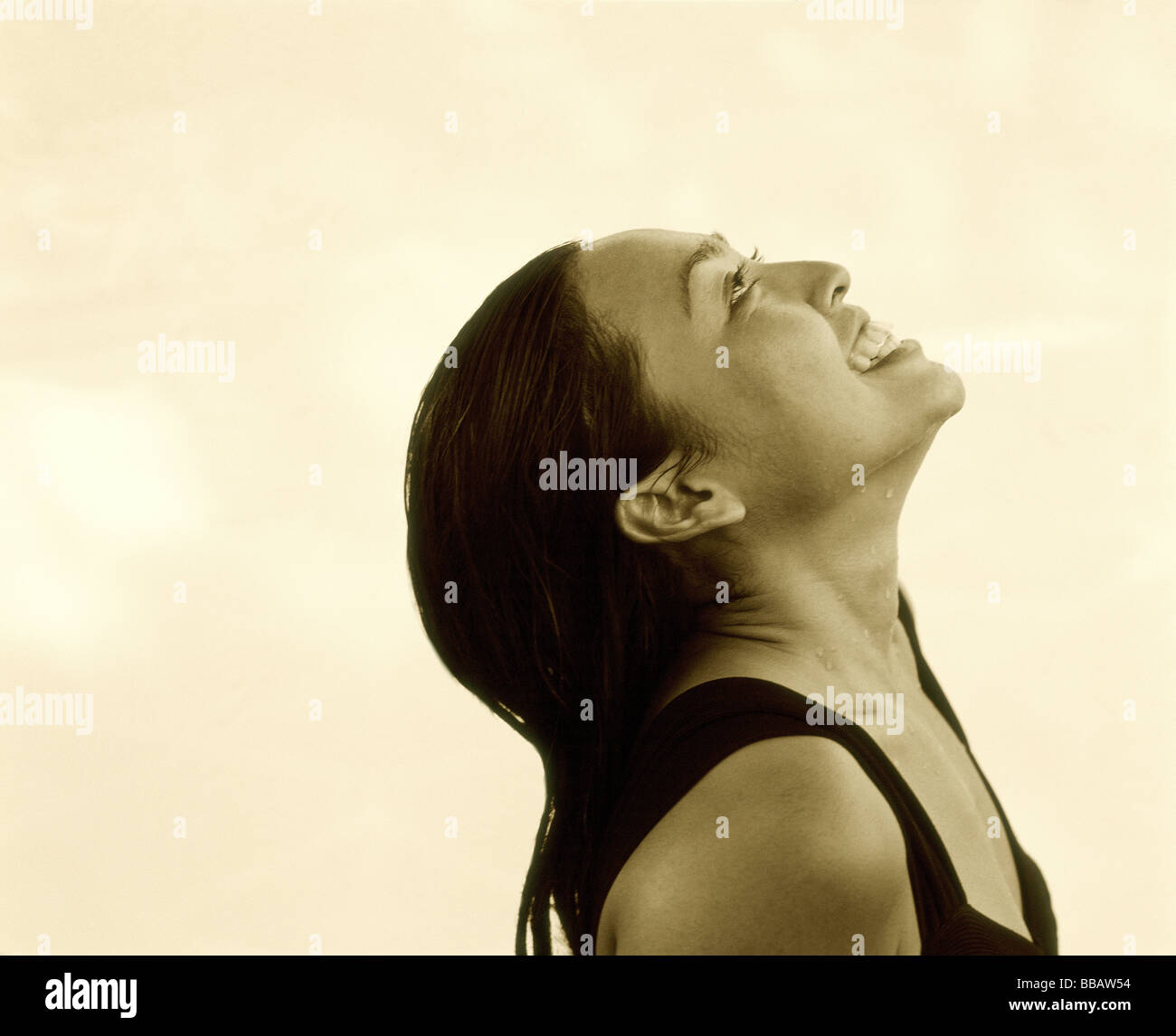 Woman looking upwards, profile, white background Stock Photo - Alamy