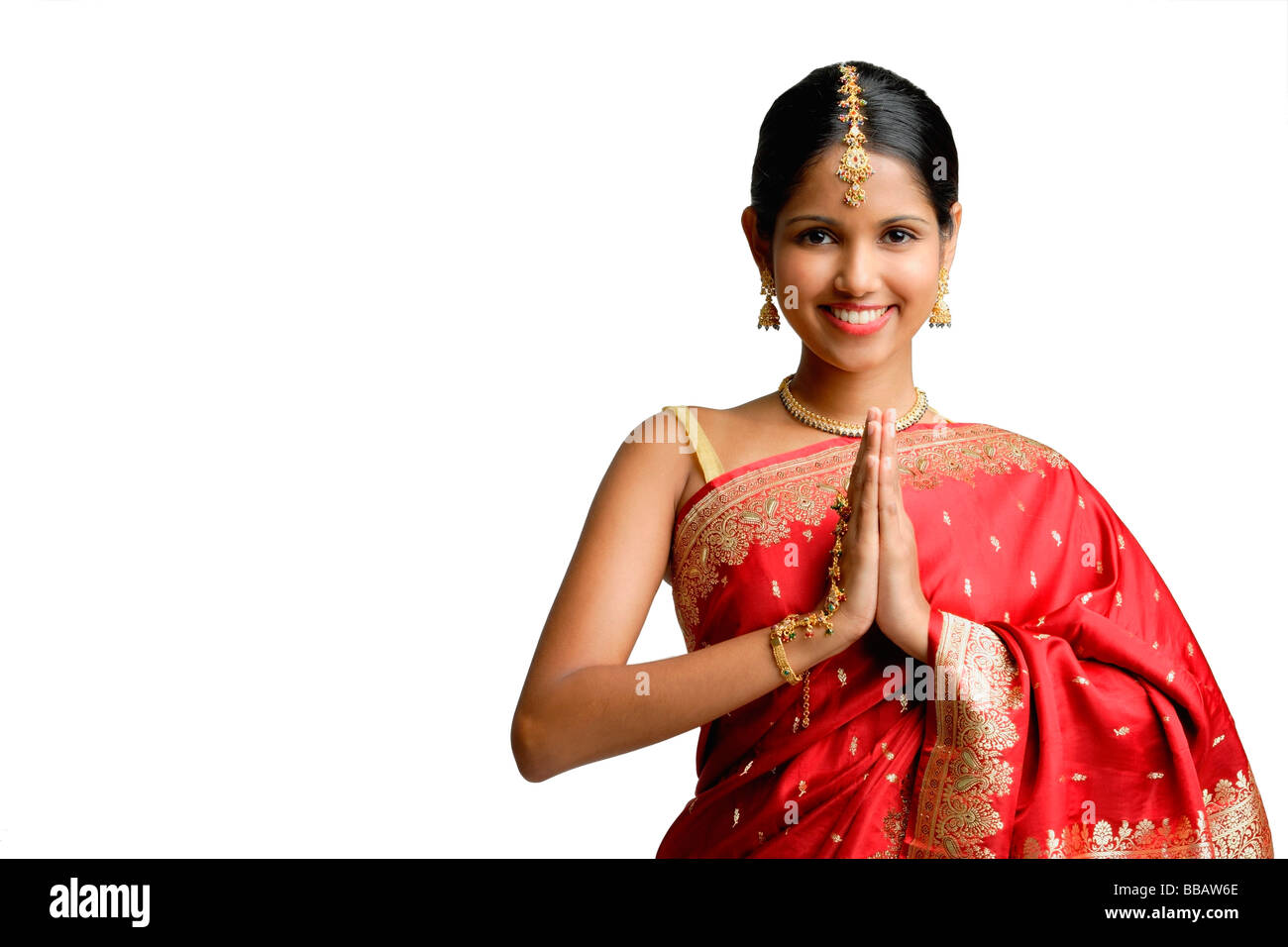 Indian woman praying in red hi-res stock photography and images - Alamy