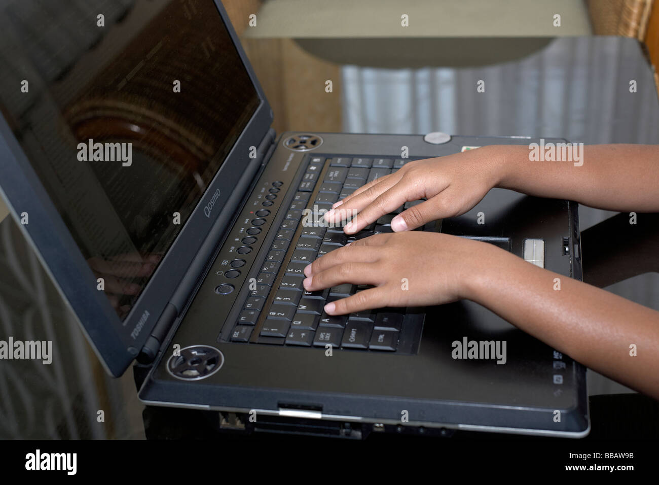 Childs hands on laptop hi-res stock photography and images - Alamy