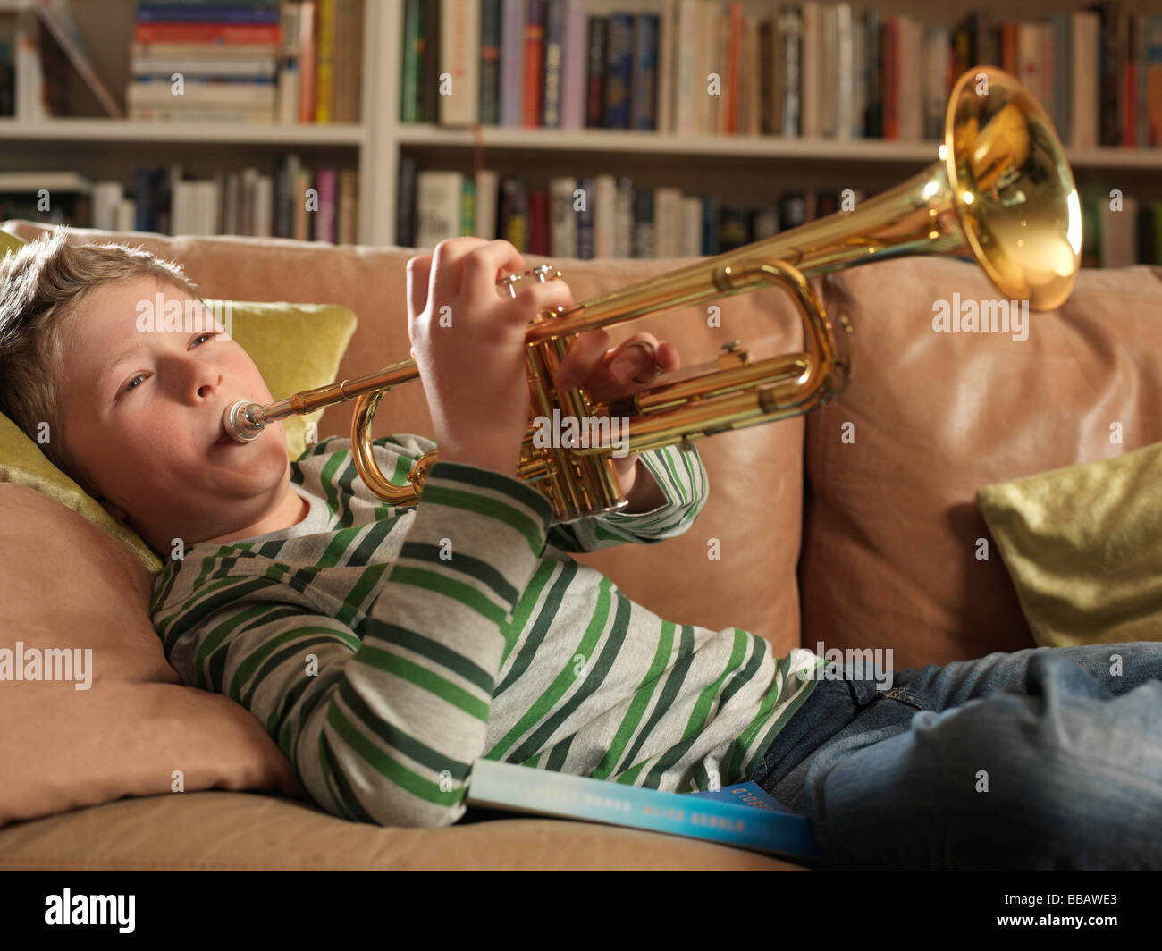 Boy, 11 playing trumpet Stock Photo - Alamy