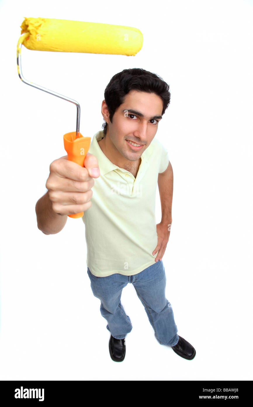 Man holding paint roller Stock Photo - Alamy
