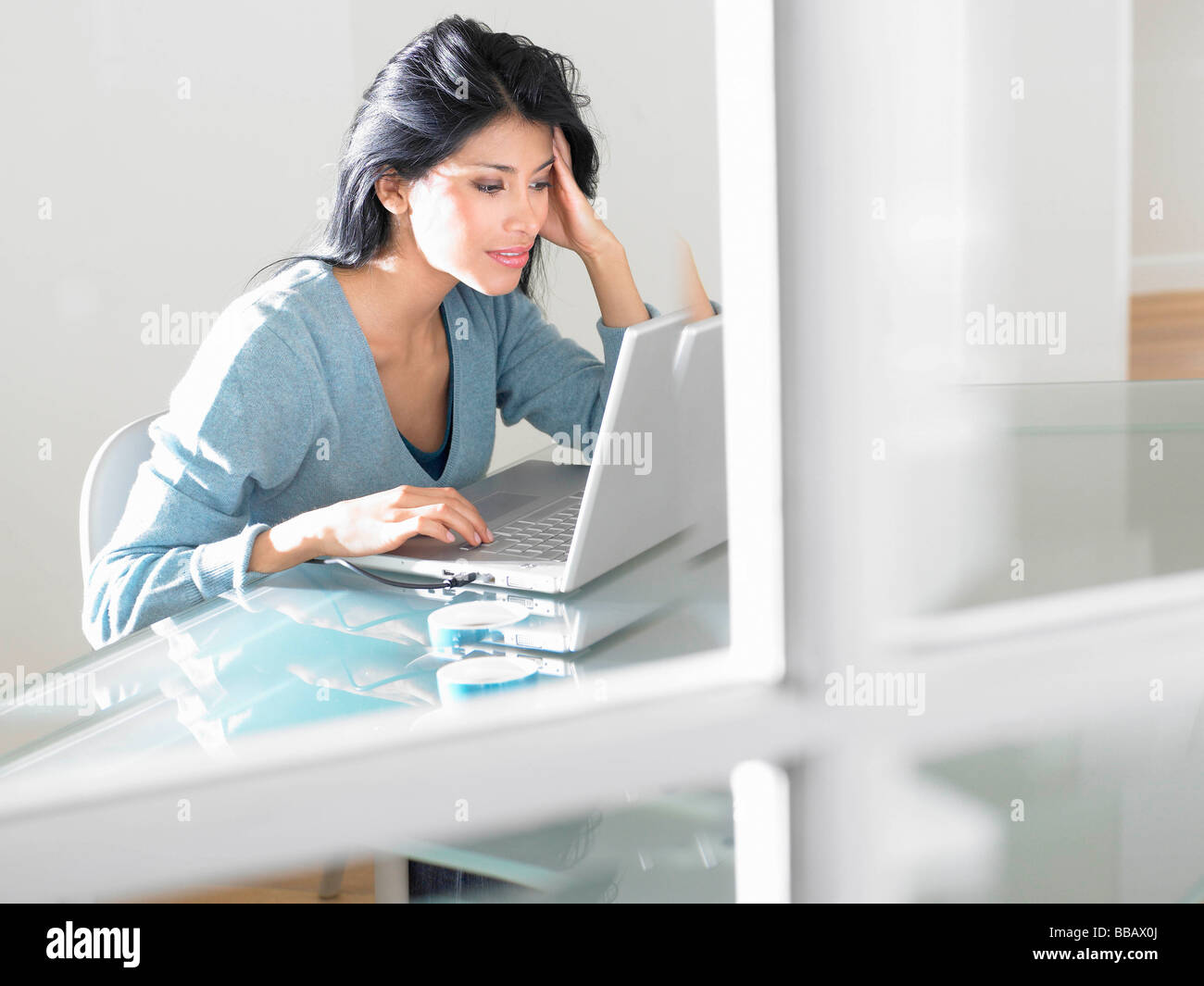 Woman working on computer Stock Photo - Alamy