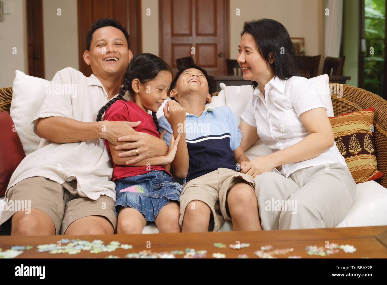Family in living room, bonding, portrait Stock Photo - Alamy