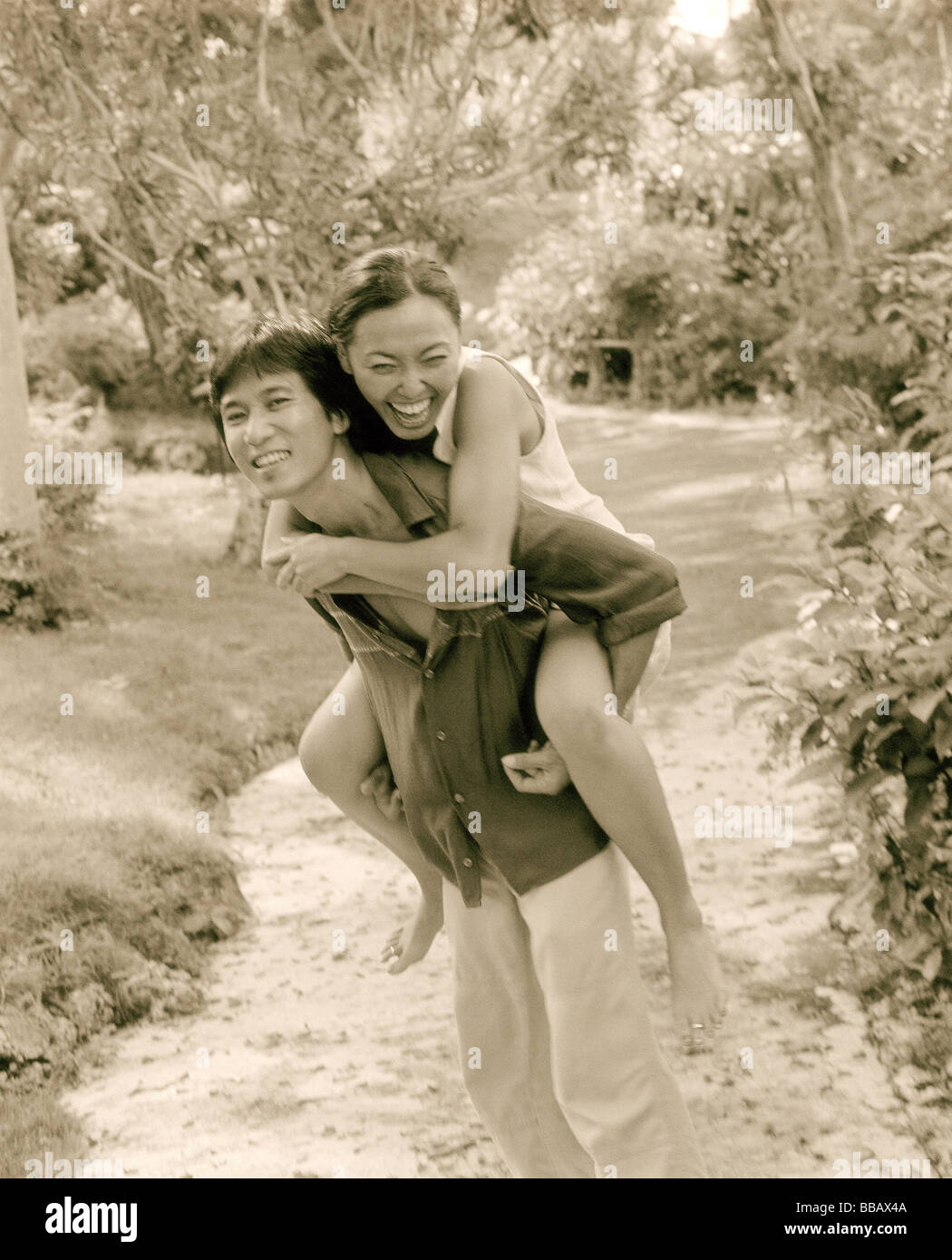 Black man carrying white woman hi-res stock photography and images - Alamy