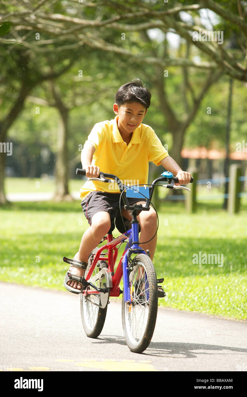 Boy on bicycle Stock Photo - Alamy