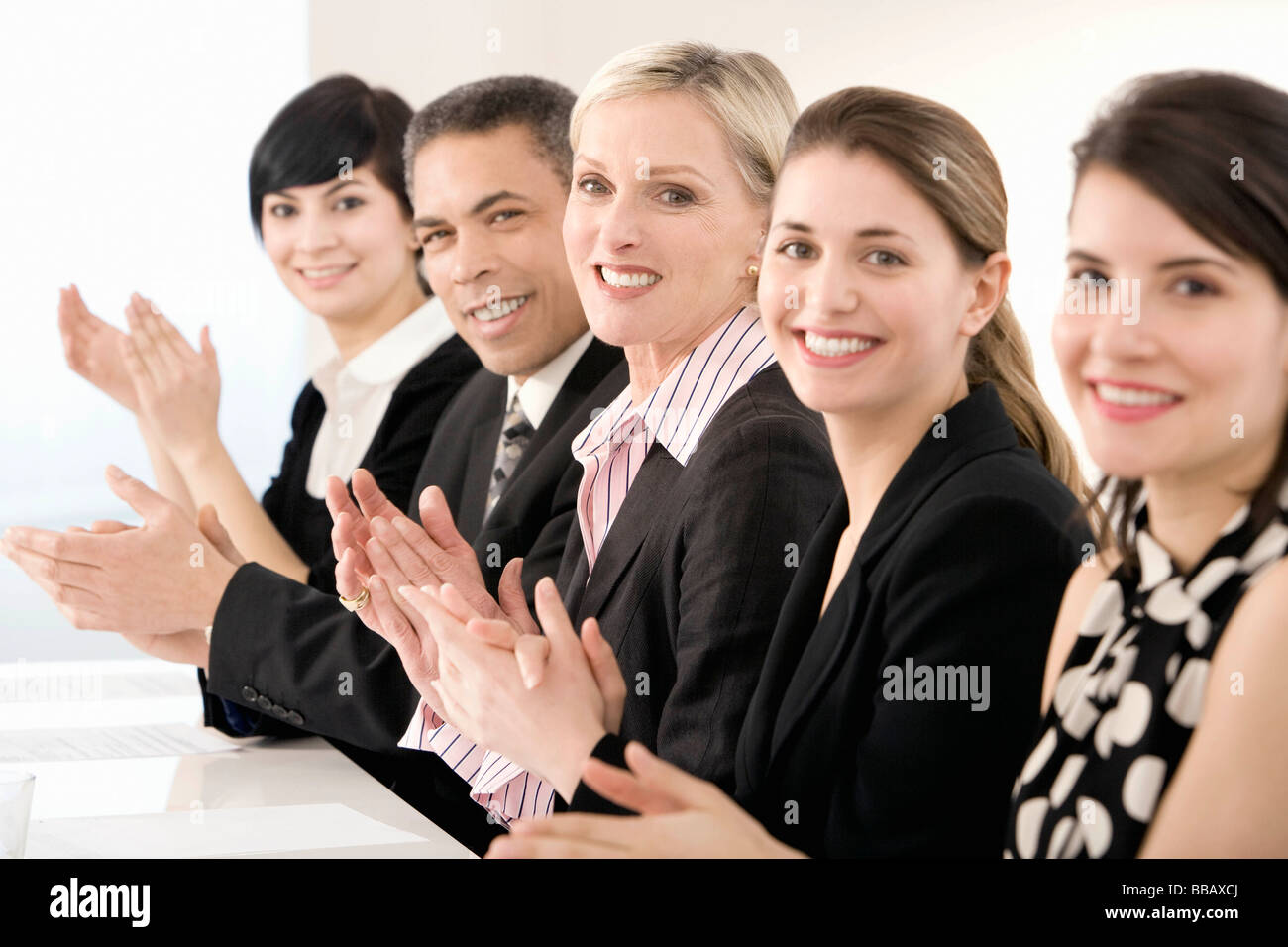 A line of business people clapping Stock Photo - Alamy