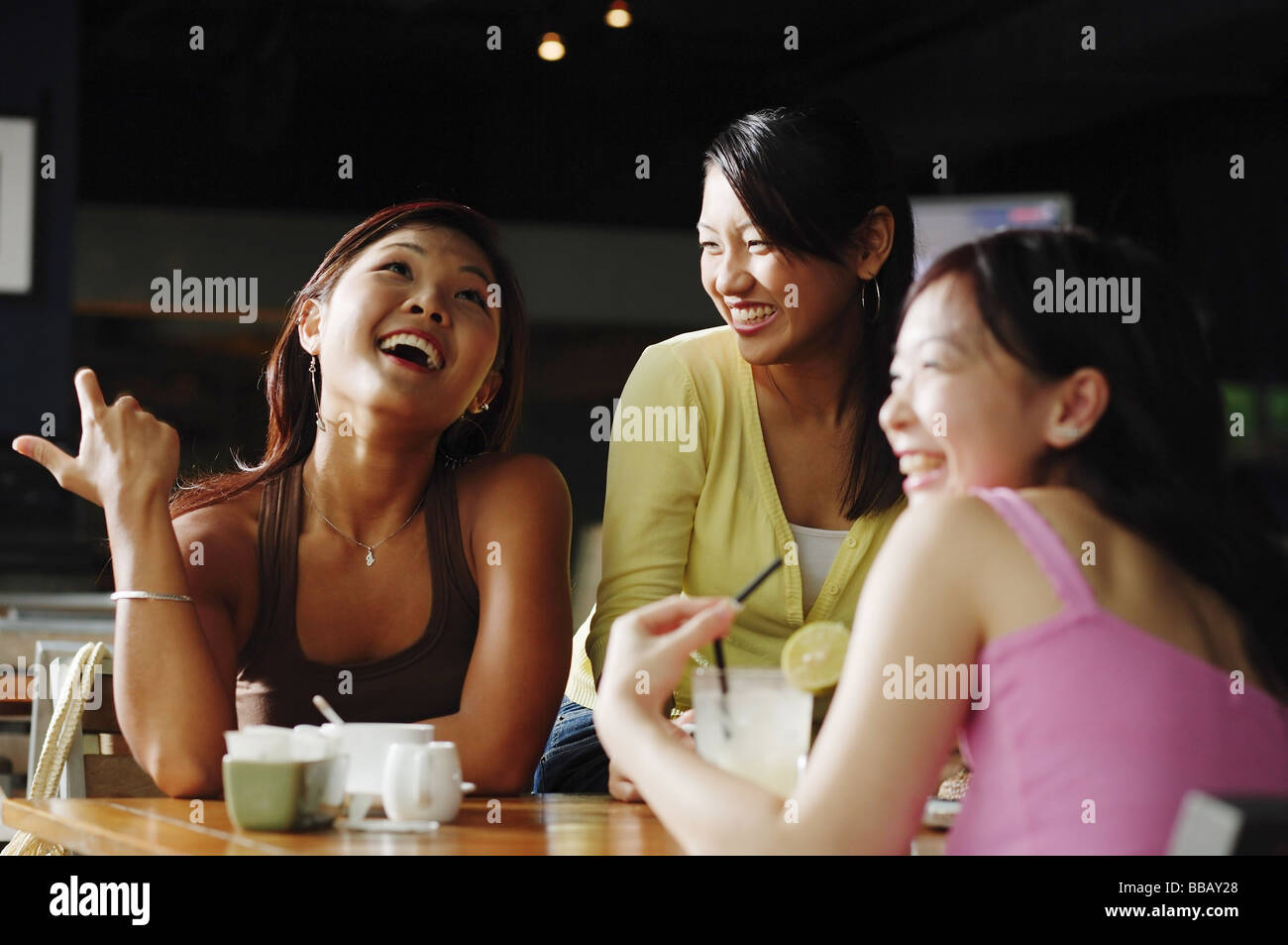 Young women at cafe Stock Photo - Alamy