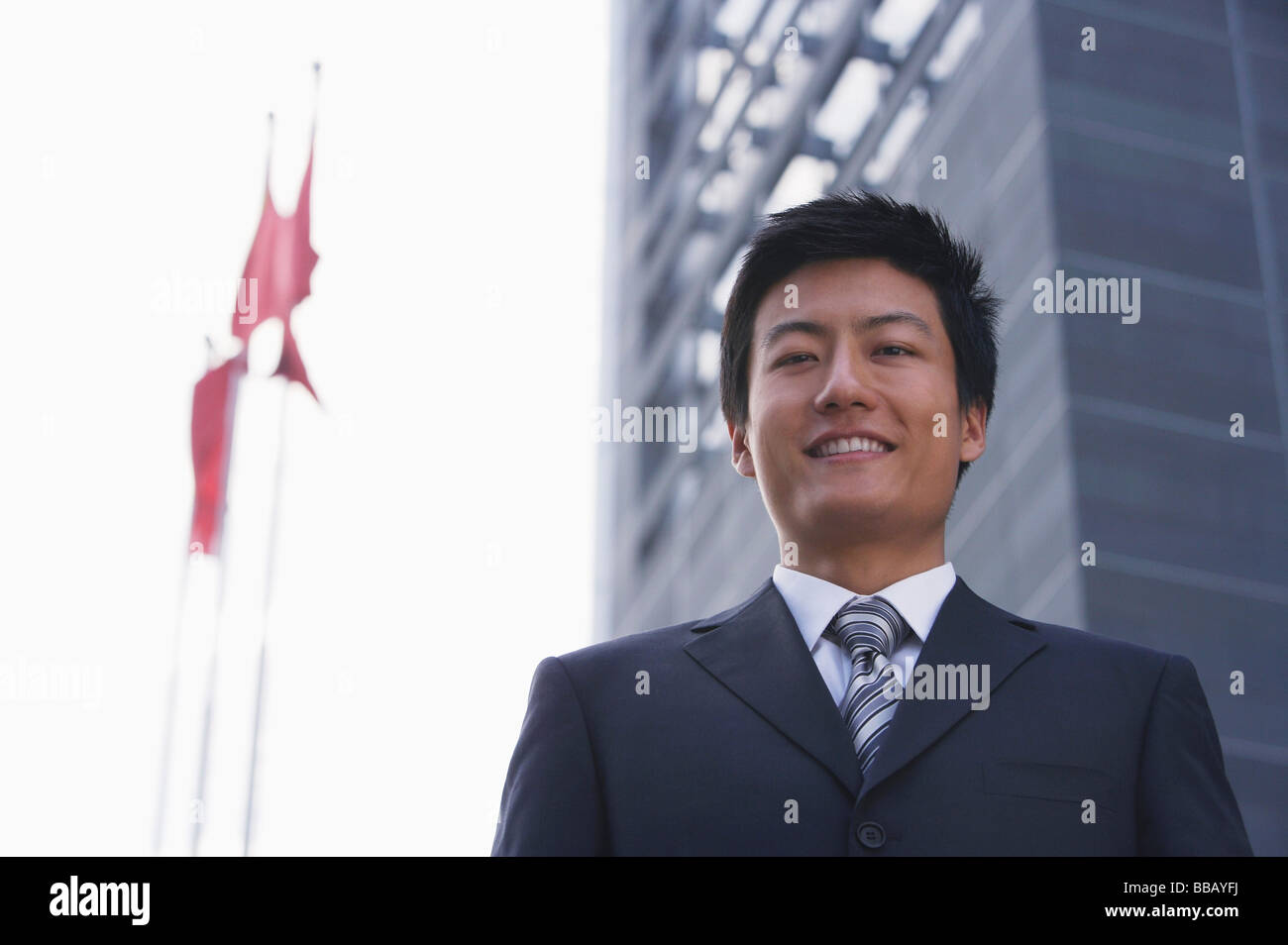 Smiling businessman in suit stands hi-res stock photography and images ...