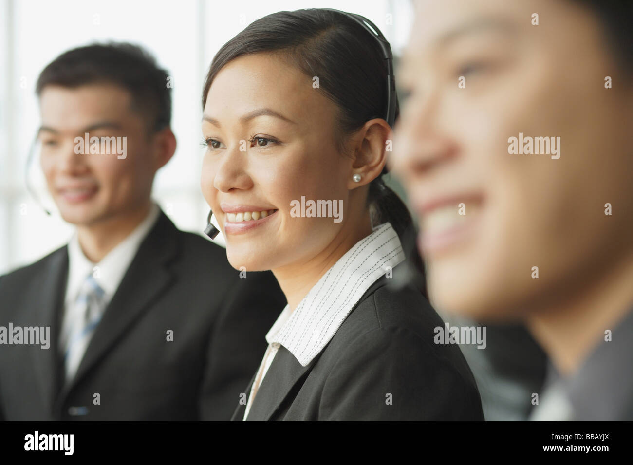 Customer service officers, in a row Stock Photo - Alamy
