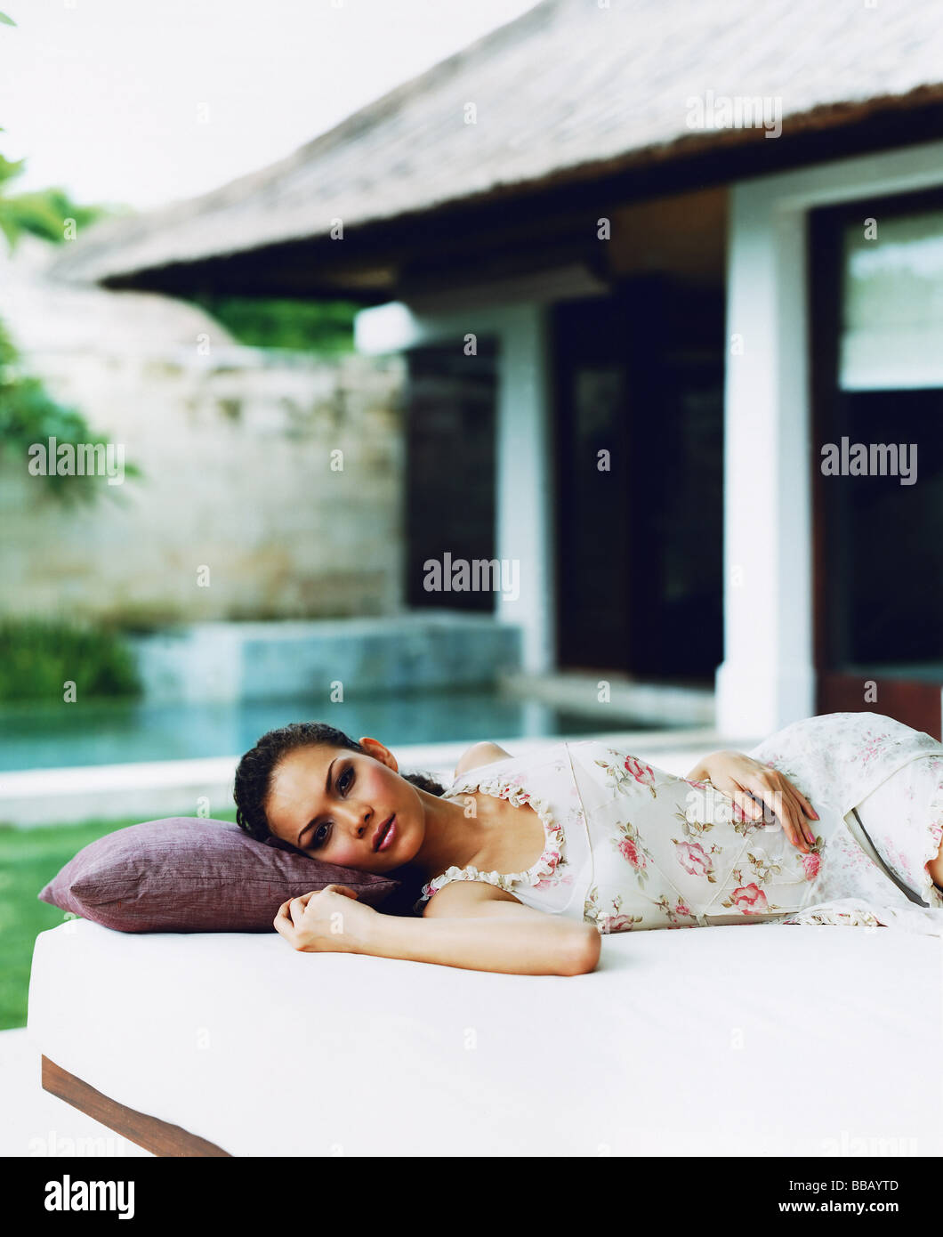 Eurasian female reclining on daybed Stock Photo - Alamy