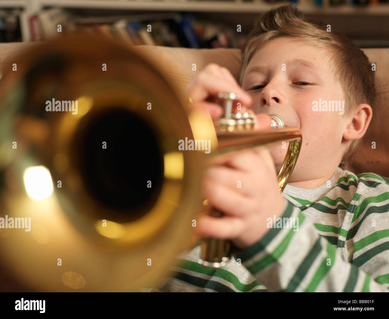 Boy, 11 playing trumpet Stock Photo - Alamy