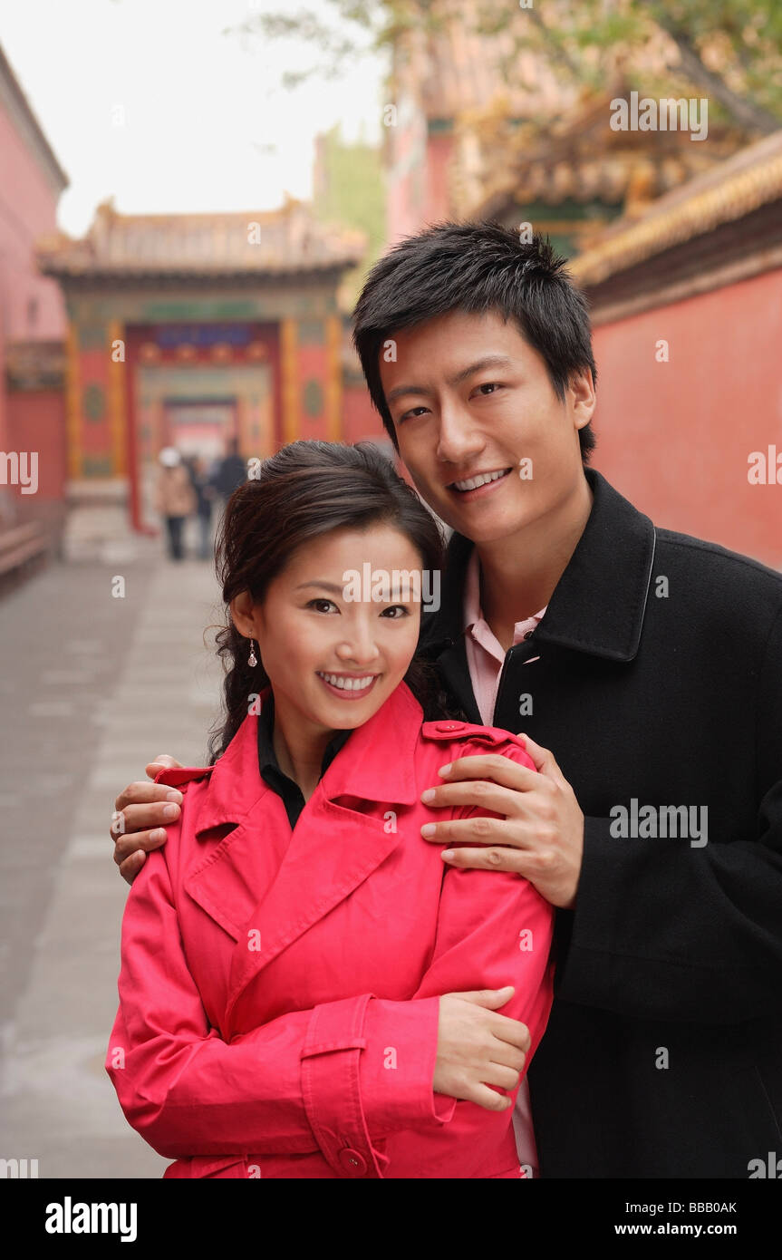 A couple with their arms around each other Stock Photo - Alamy