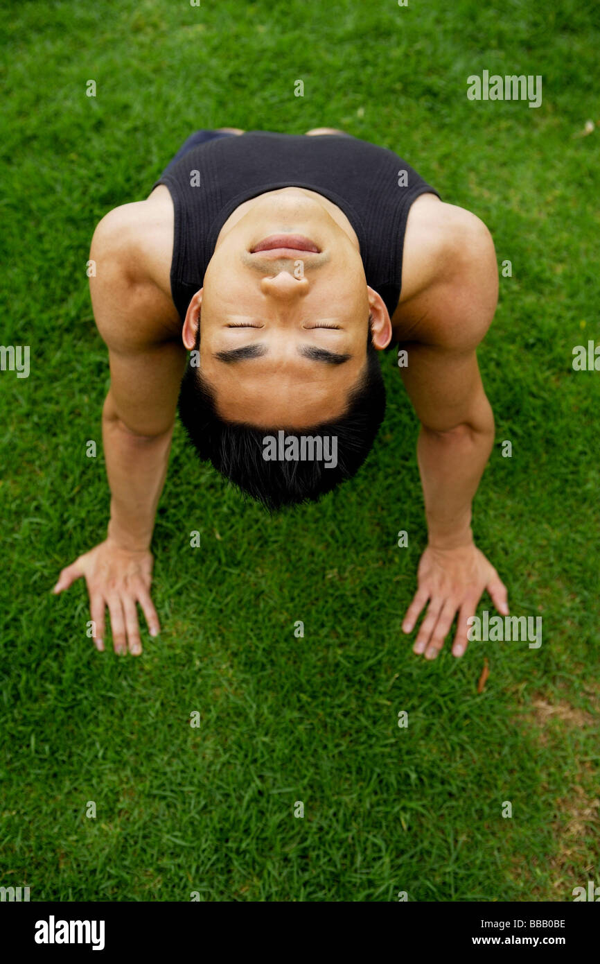Man stretching, leaning on hands Stock Photo - Alamy