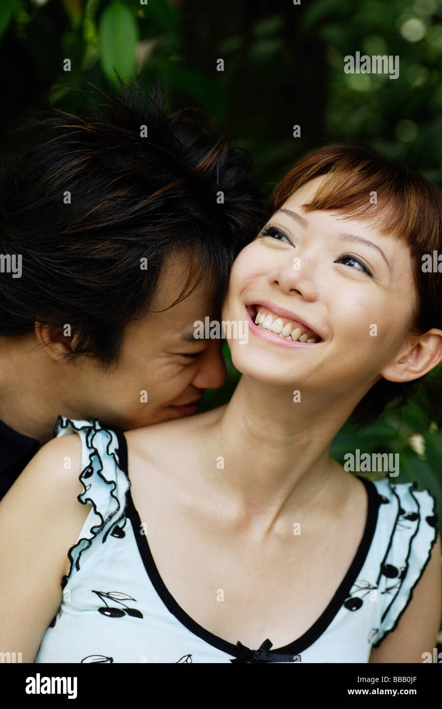 Man nuzzling her neck hi-res stock photography and images - Alamy