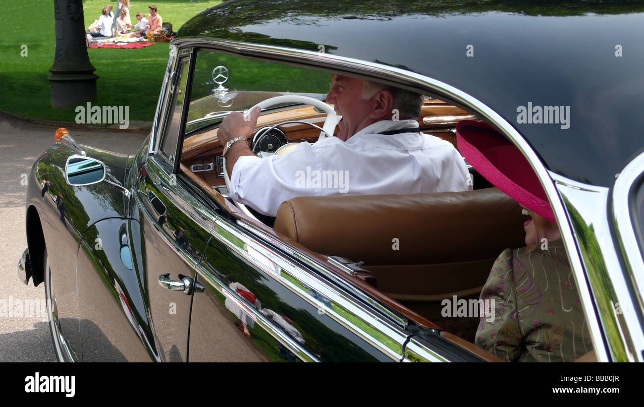 Mercedes Benz classic car with chauffeur and elegant lady Stock Photo ...