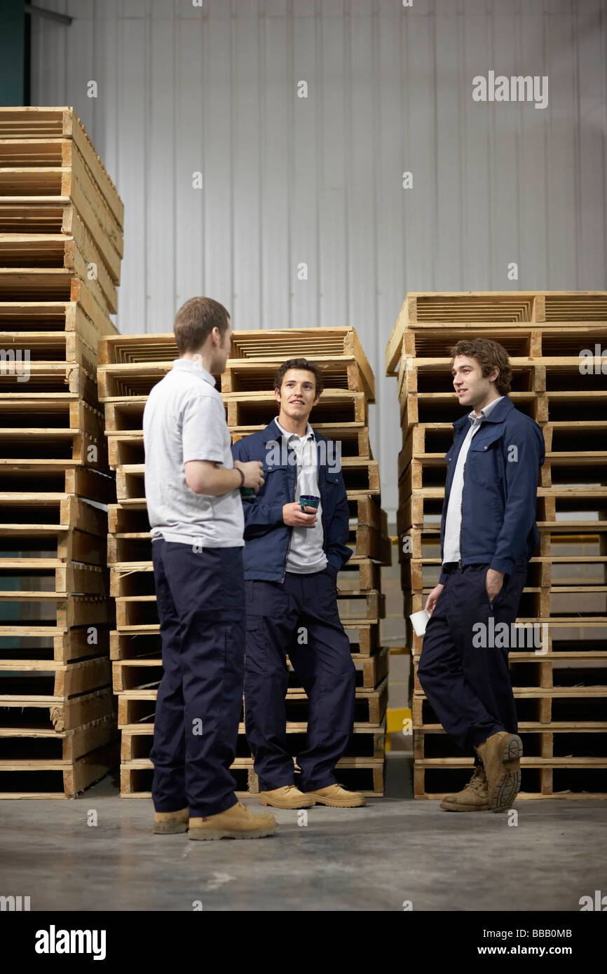 Workers in warehouse having break Stock Photo - Alamy