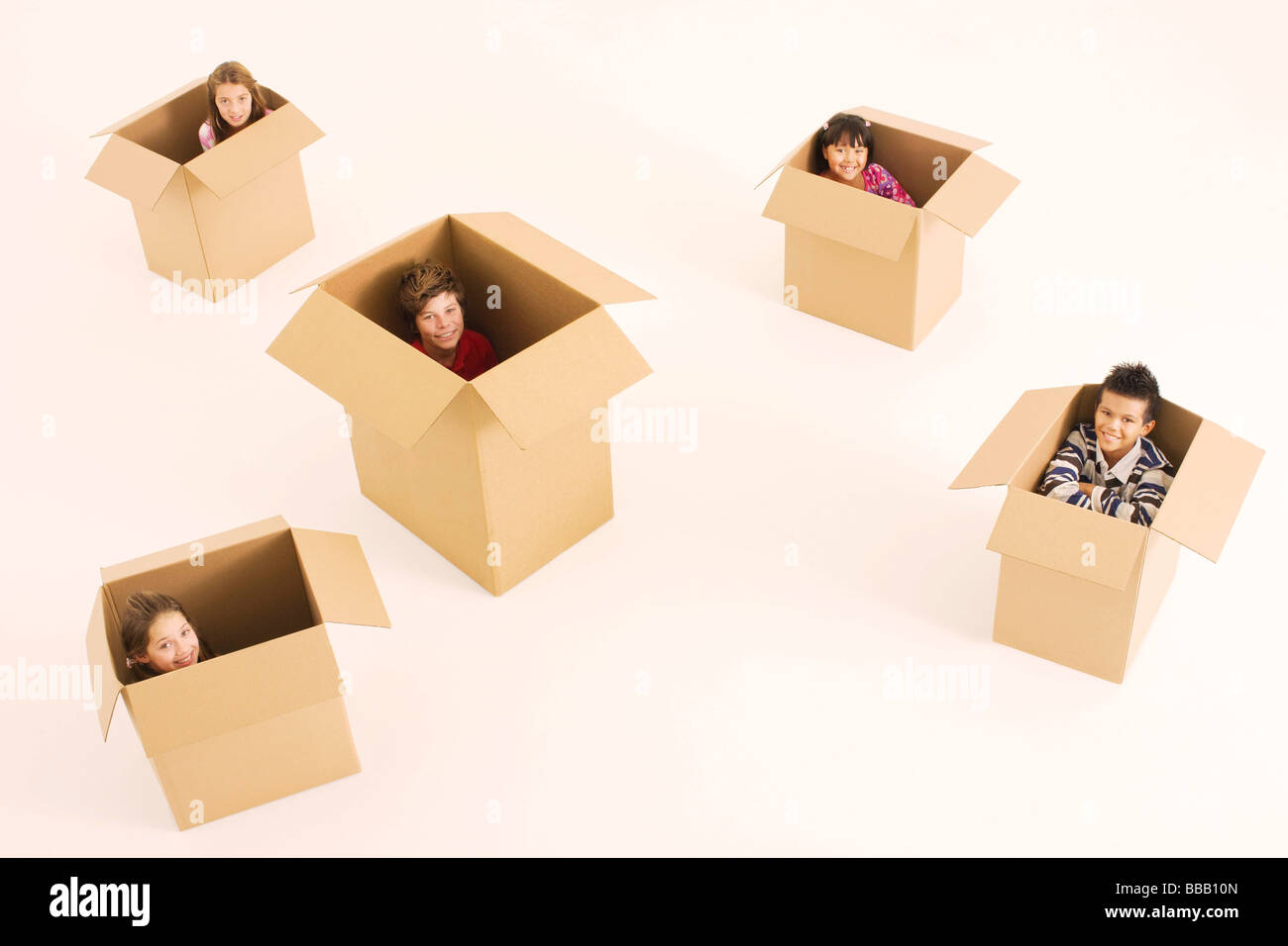 children sitting in boxes Stock Photo - Alamy