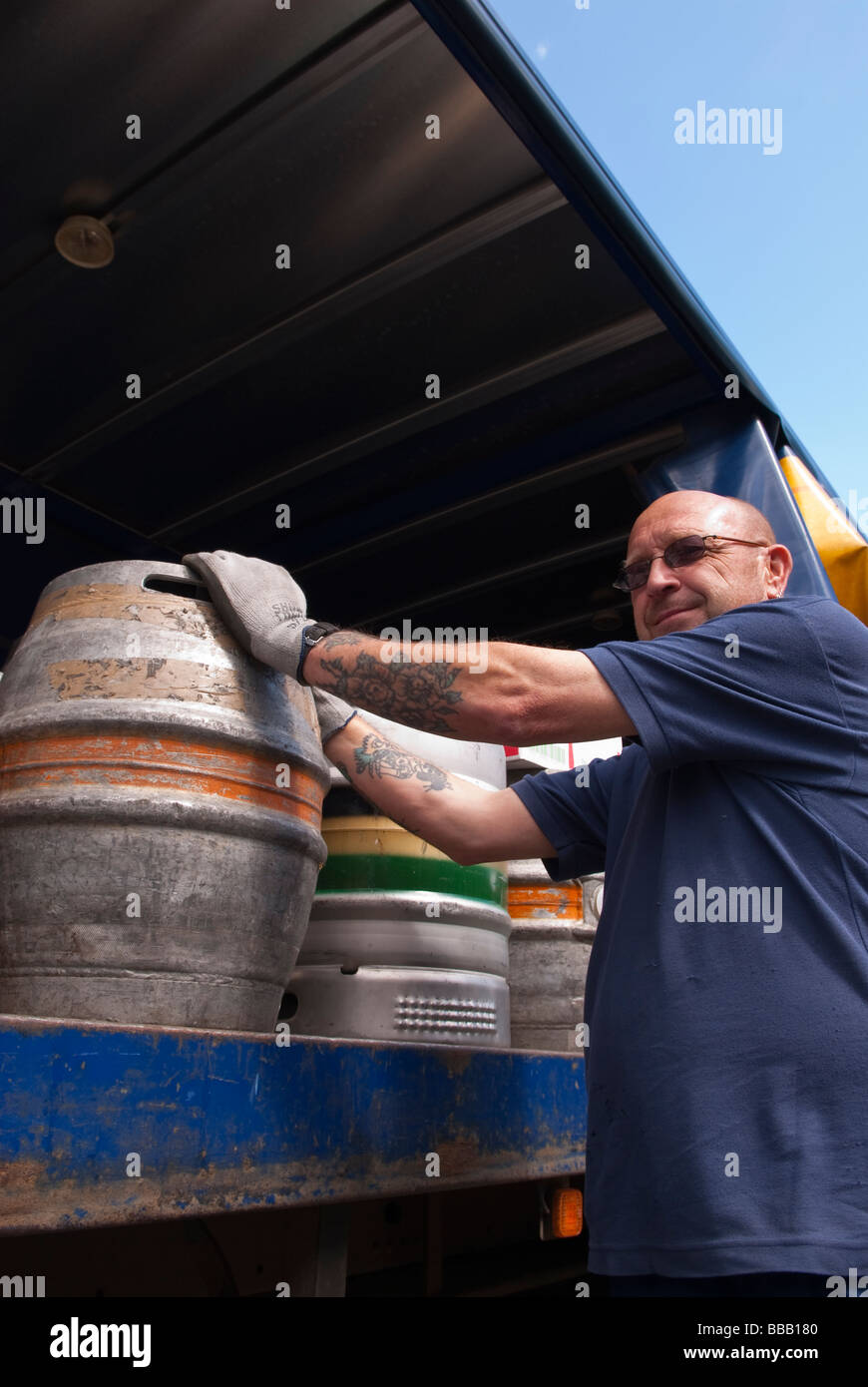Man unloading barrels hi-res stock photography and images - Alamy