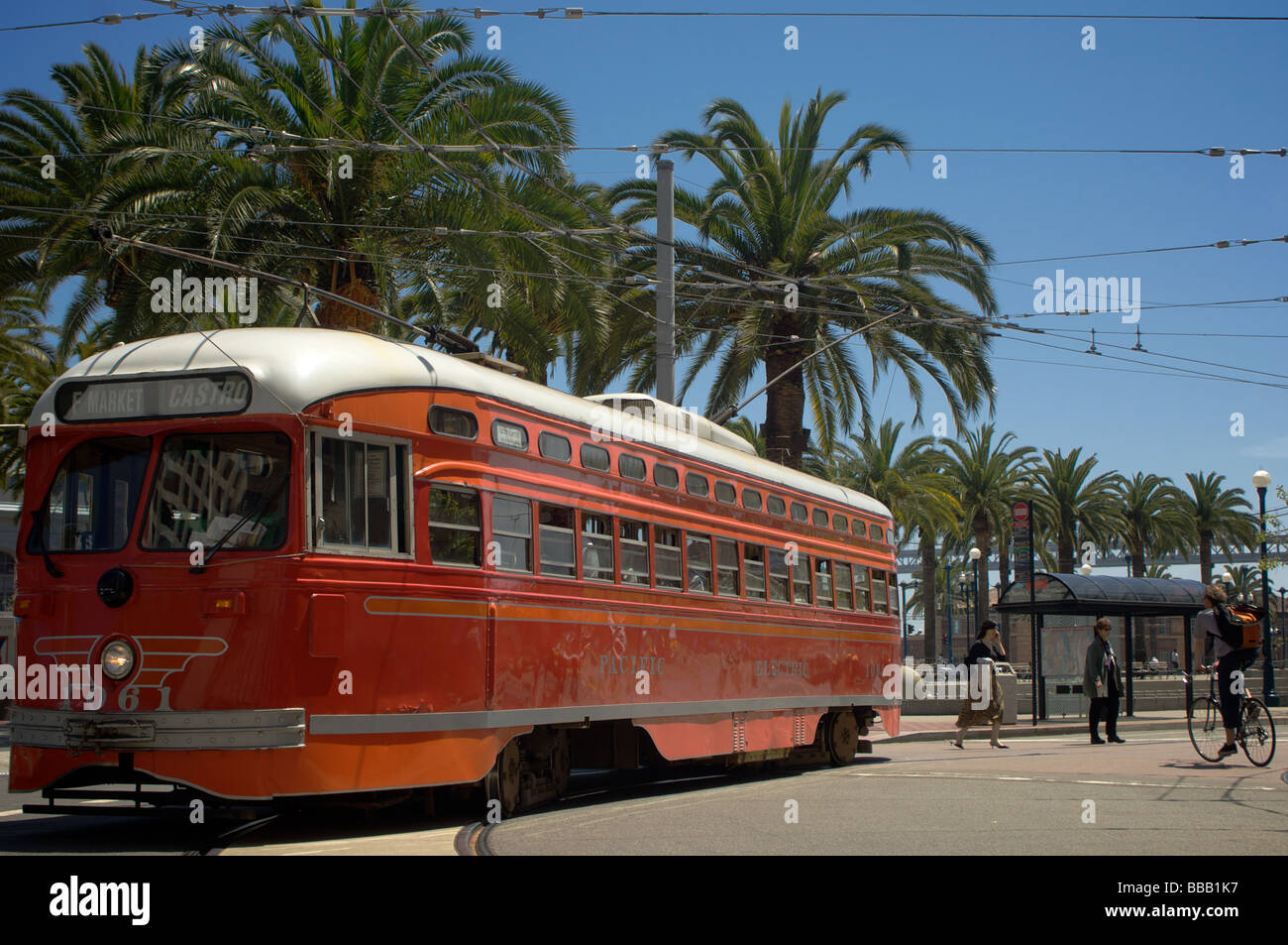 a streetcar of the f line in san francisco turns at the ferry building ...