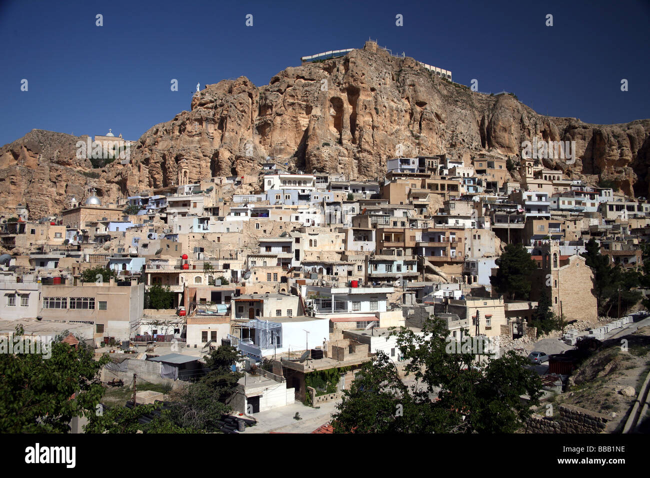 Houses built in rocks at Maalula Syria Stock Photo - Alamy