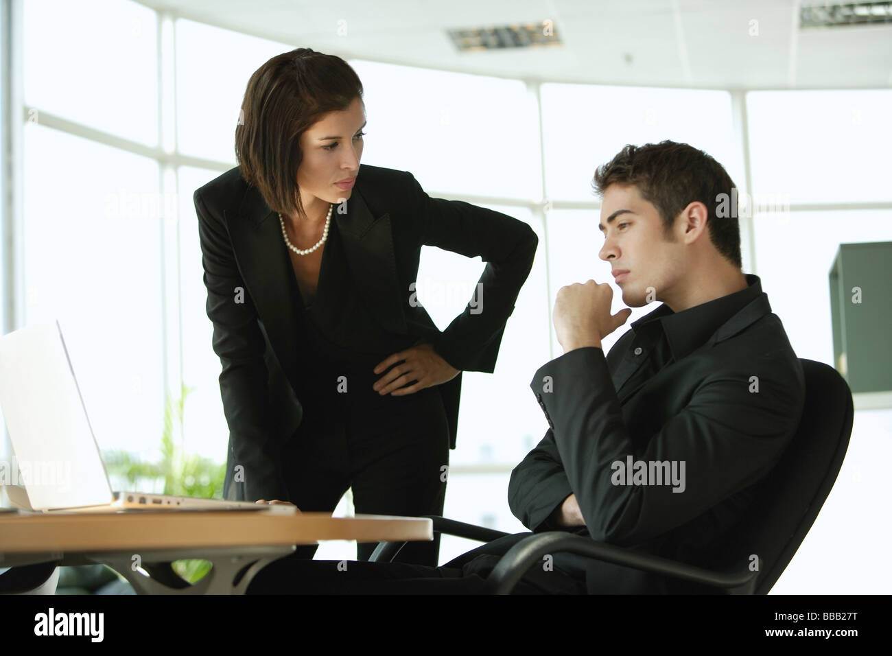 Serious businesswoman in black shirt hi-res stock photography and ...
