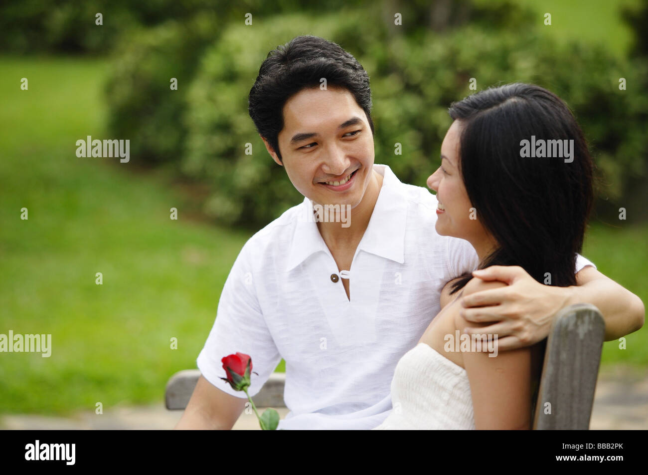 Couple smiling at each other Stock Photo - Alamy