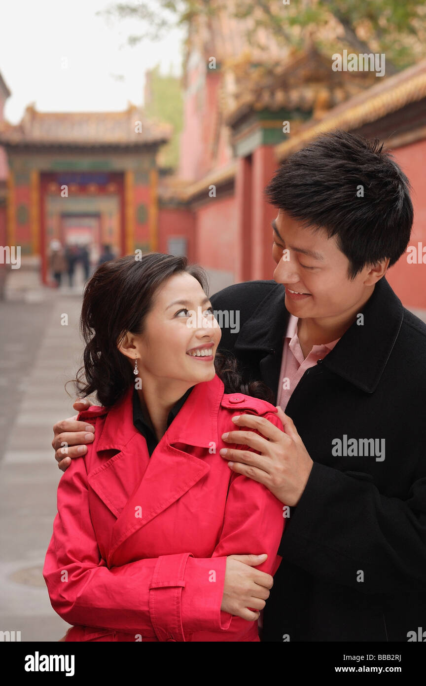 A couple with their arms around each other Stock Photo - Alamy