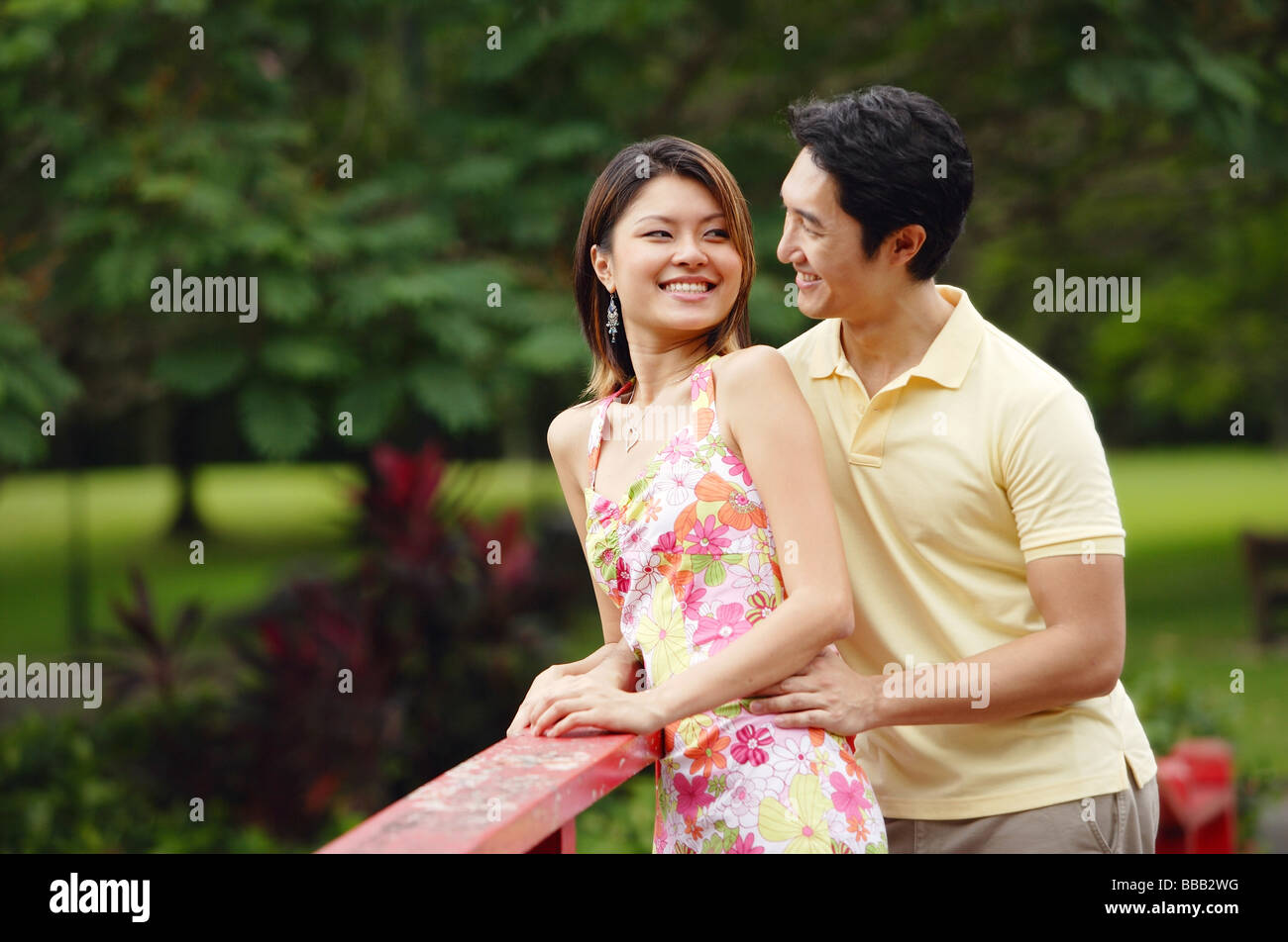 Couple standing side by side, looking at each other, portrait Stock ...