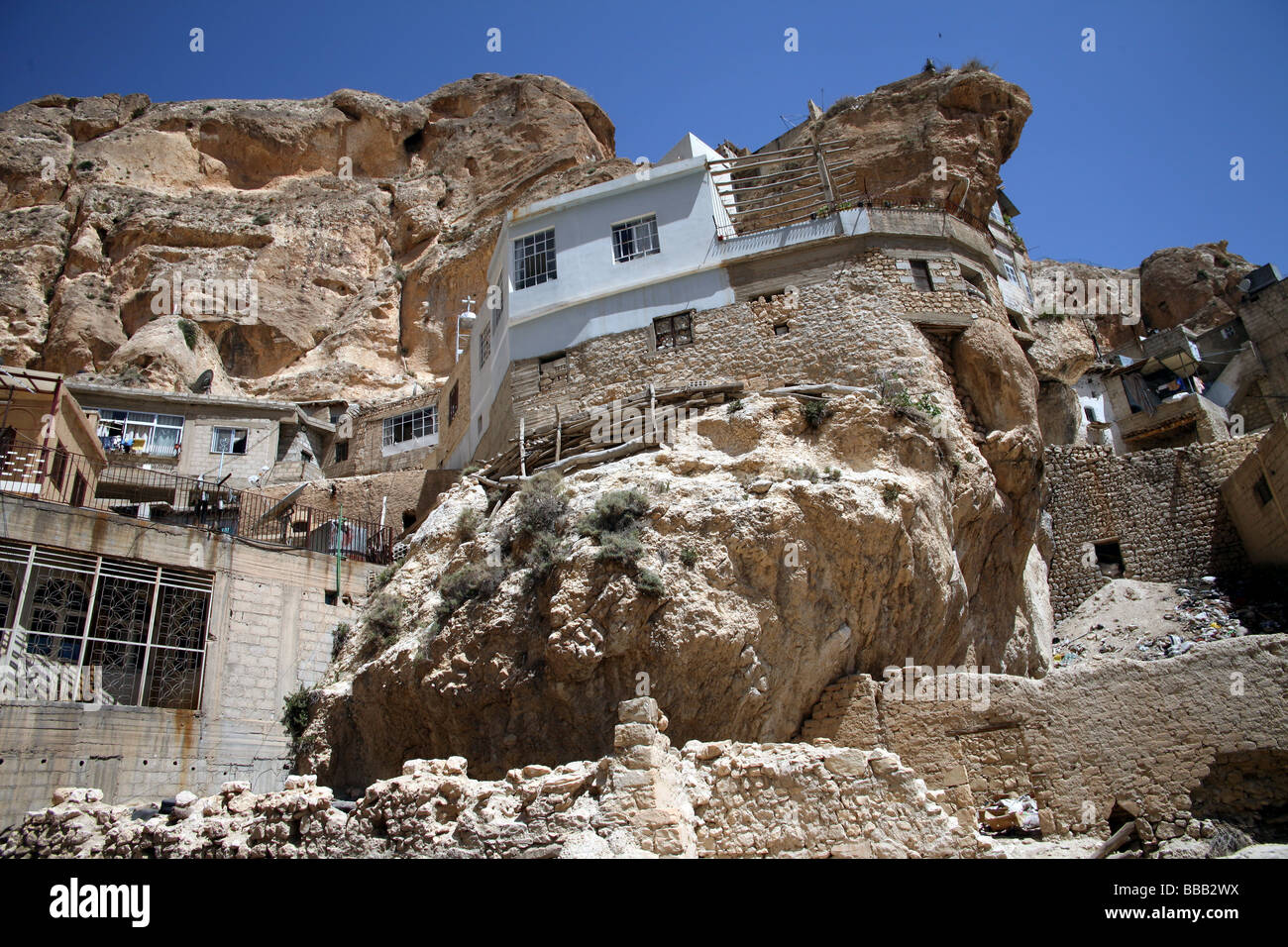 Houses built in rocks at Maalula Syria Stock Photo - Alamy
