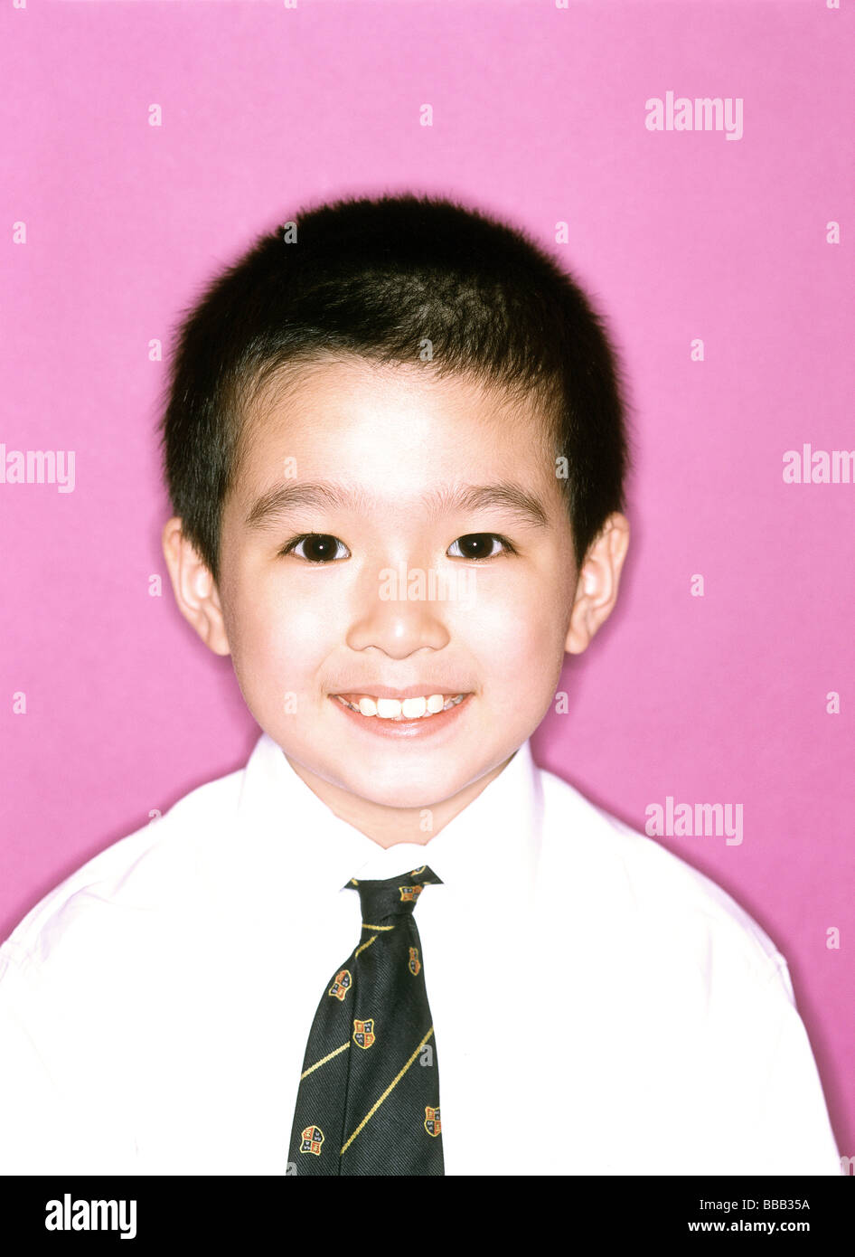 Young boy dressed in tie and shirt, portrait, purple background Stock ...