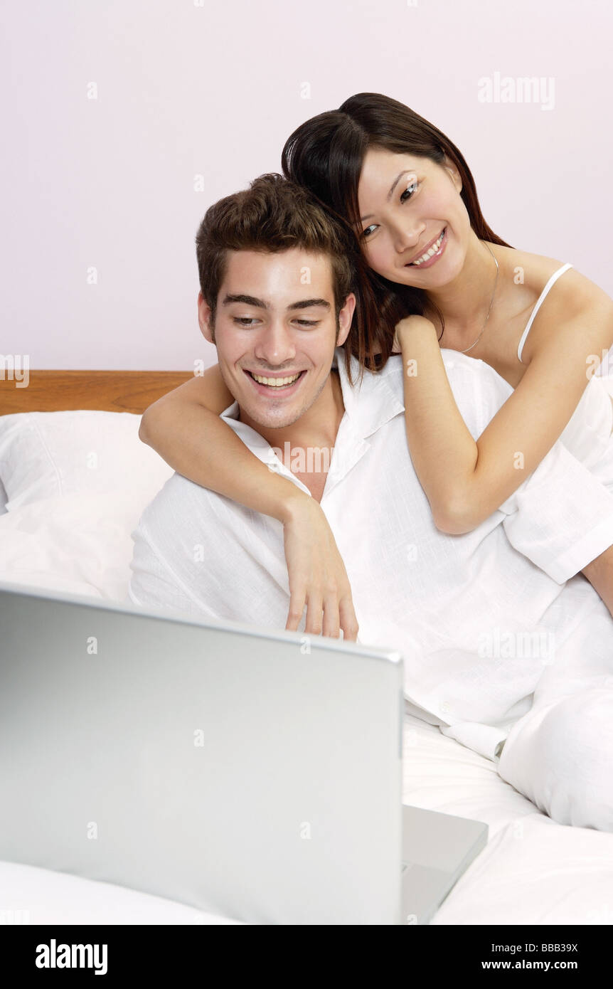 Multi racial couple bed hi-res stock photography and images - Alamy