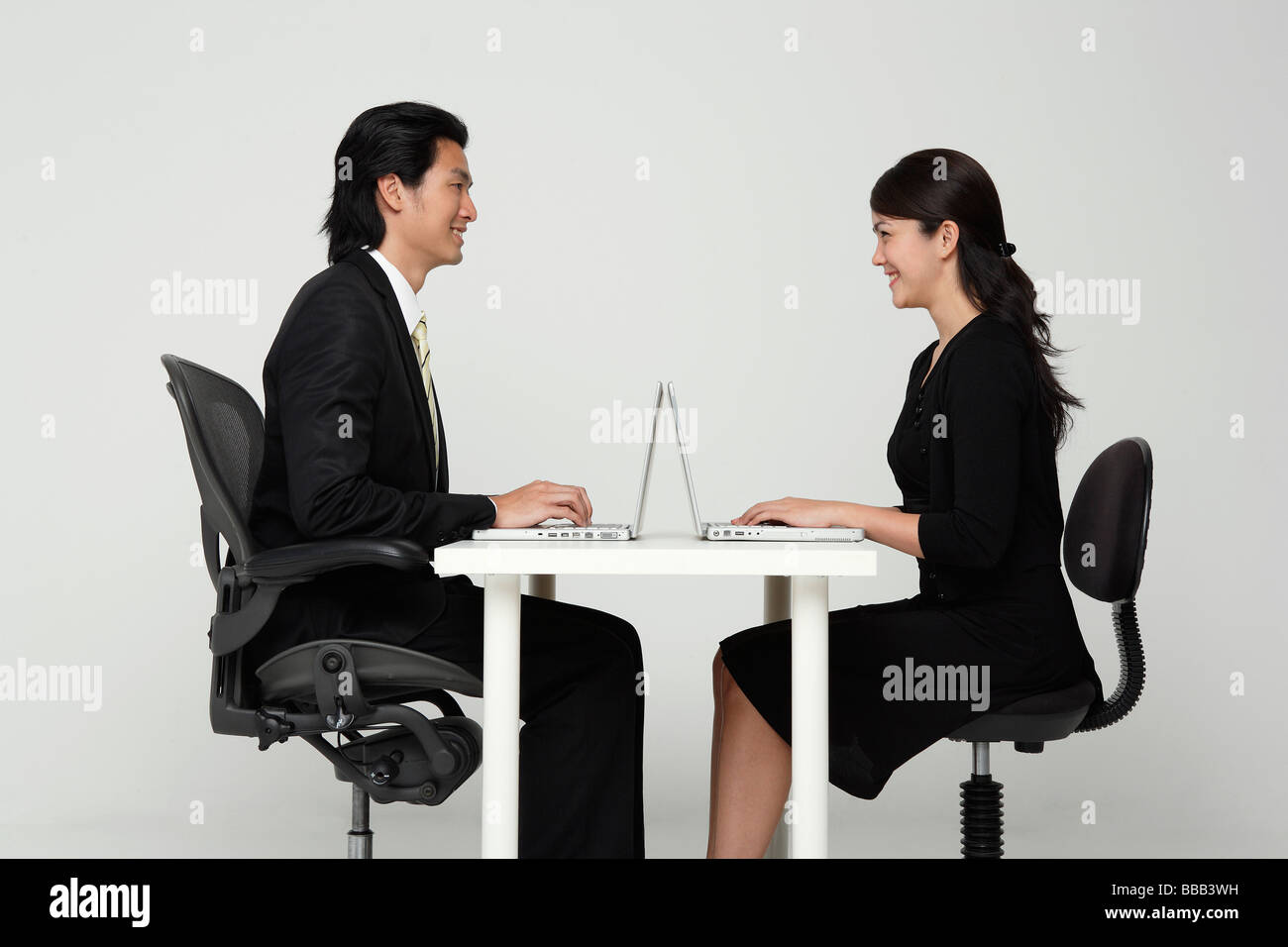 Profile of business colleagues working at computers Stock Photo - Alamy