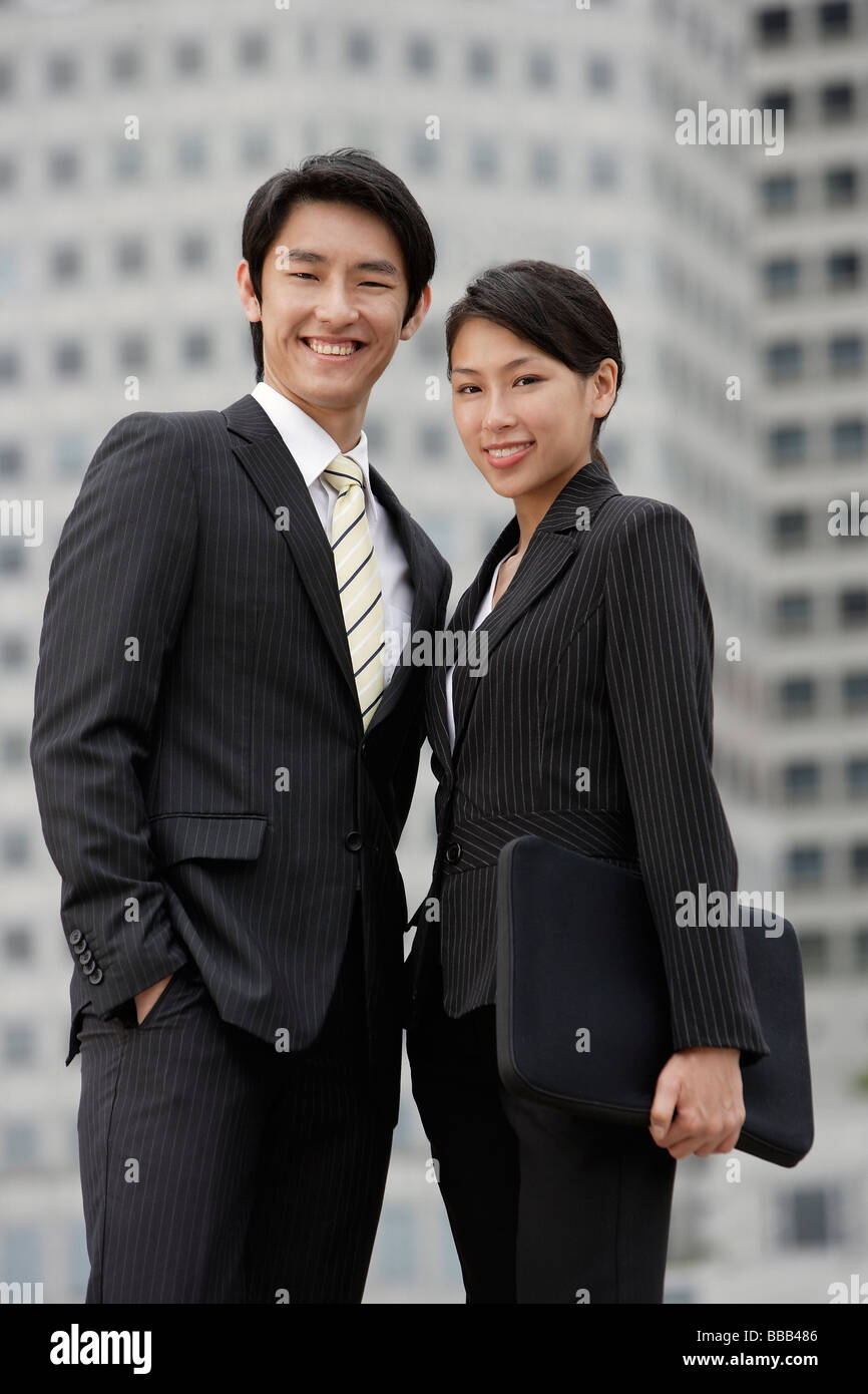 Portrait of business colleagues smiling Stock Photo - Alamy