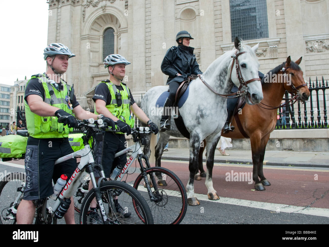 Mounted City of London police on bicycles and horseback Stock Photo ...